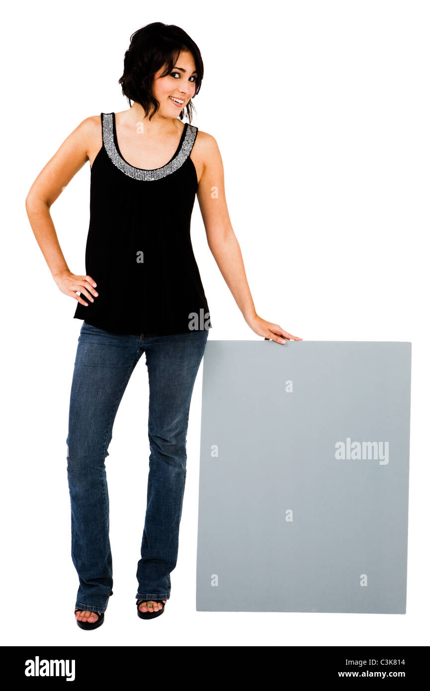 Young woman showing an empty placard isolated over white Stock Photo ...