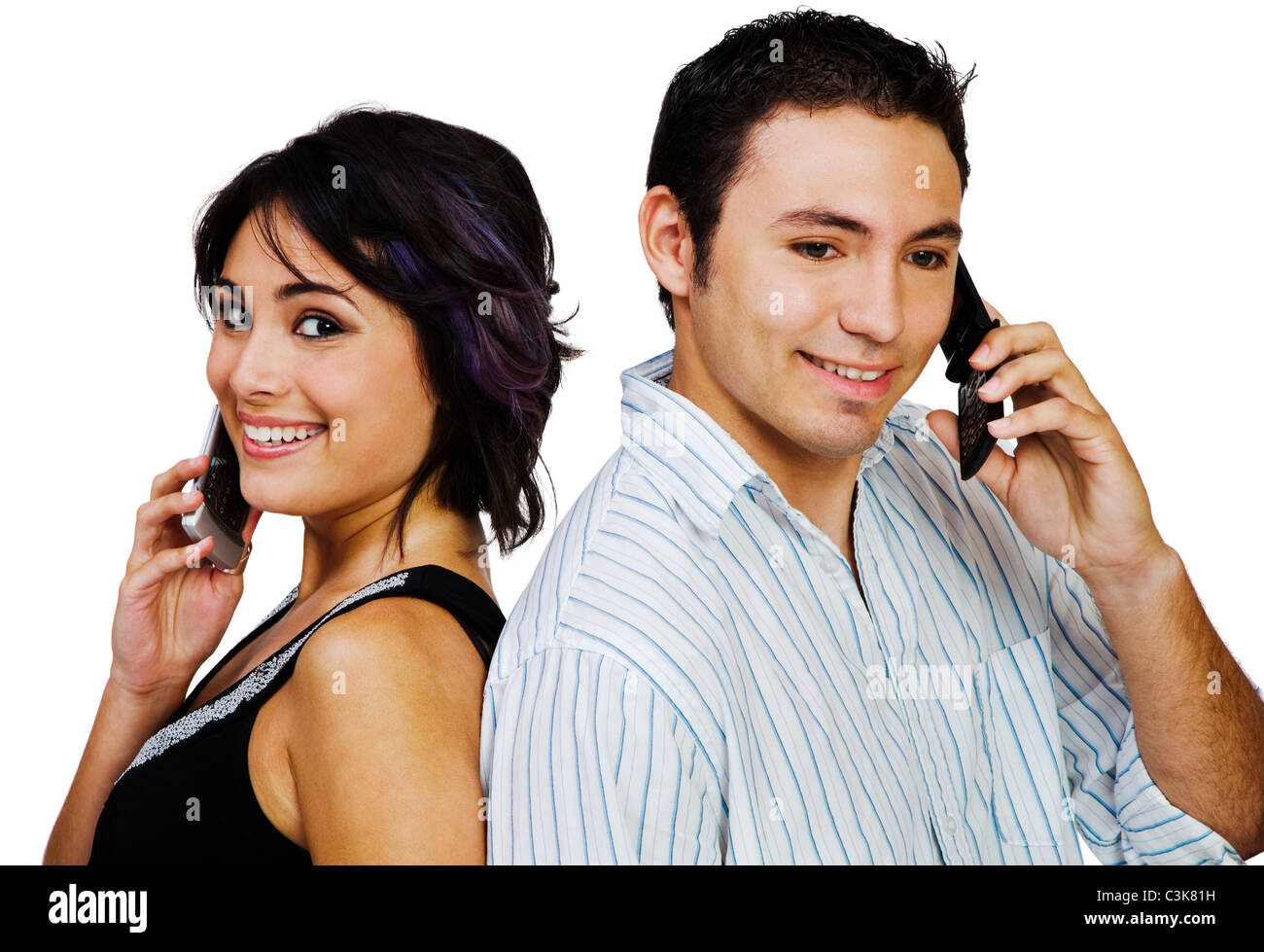 Happy couple talking on mobile phones isolated over white Stock Photo ...