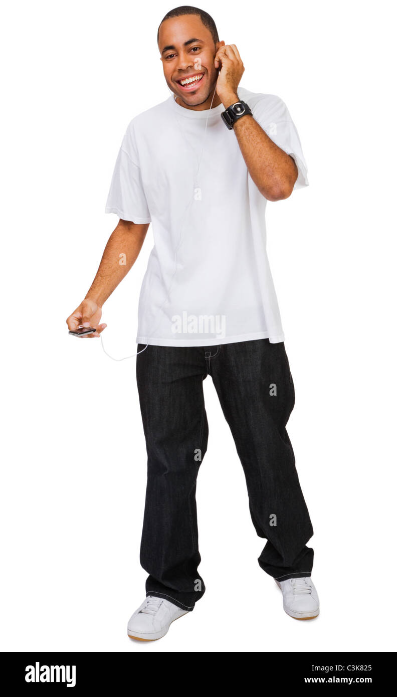 Happy man listening to music on a MP3 player isolated over white Stock ...