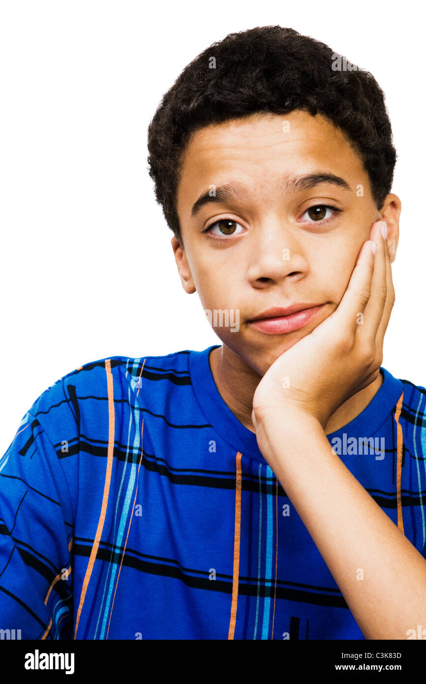 Teenage boy thinking isolated over white Stock Photo - Alamy