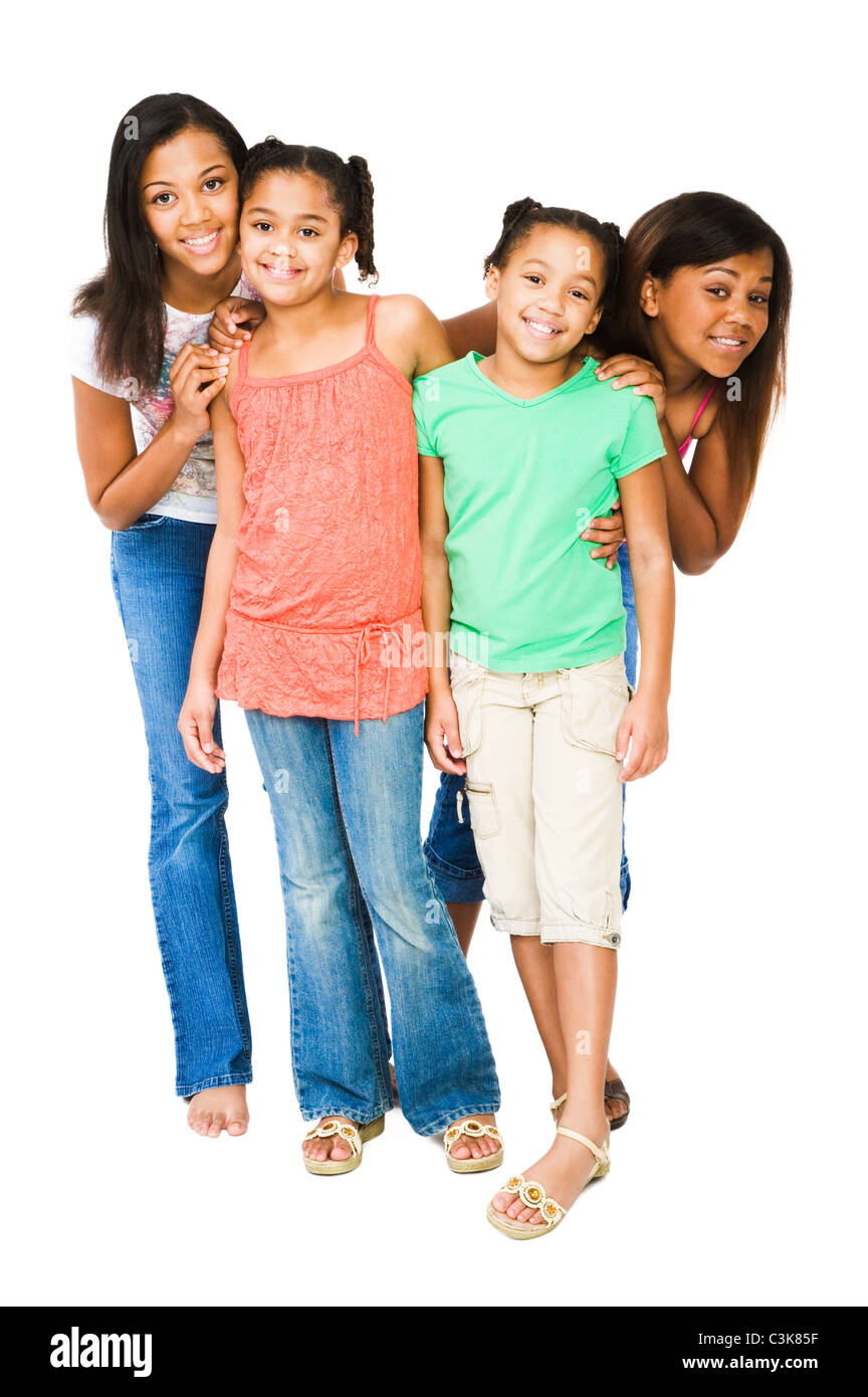 Happy friends standing together and posing isolated over white Stock ...