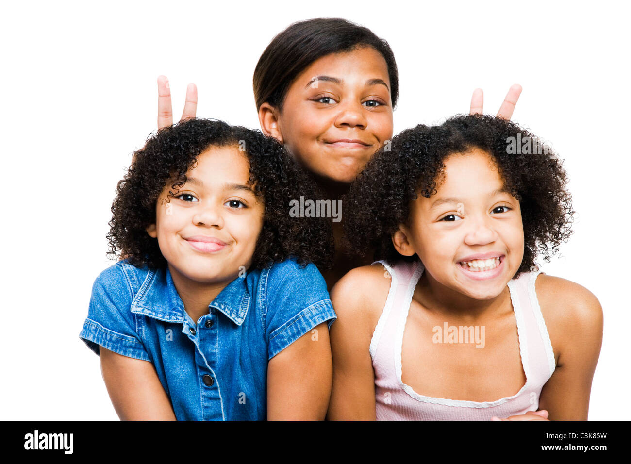 Three friends posing and smiling together isolated over white Stock ...