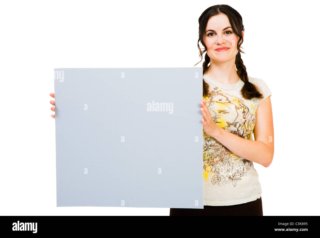 Beautiful woman holding a placard and posing isolated over white Stock ...
