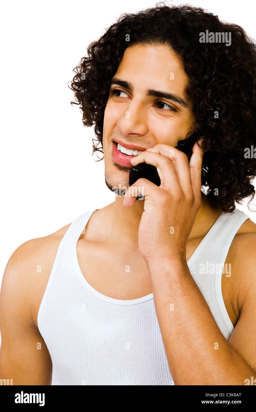 Man talking on a mobile phone and smiling isolated over white Stock ...