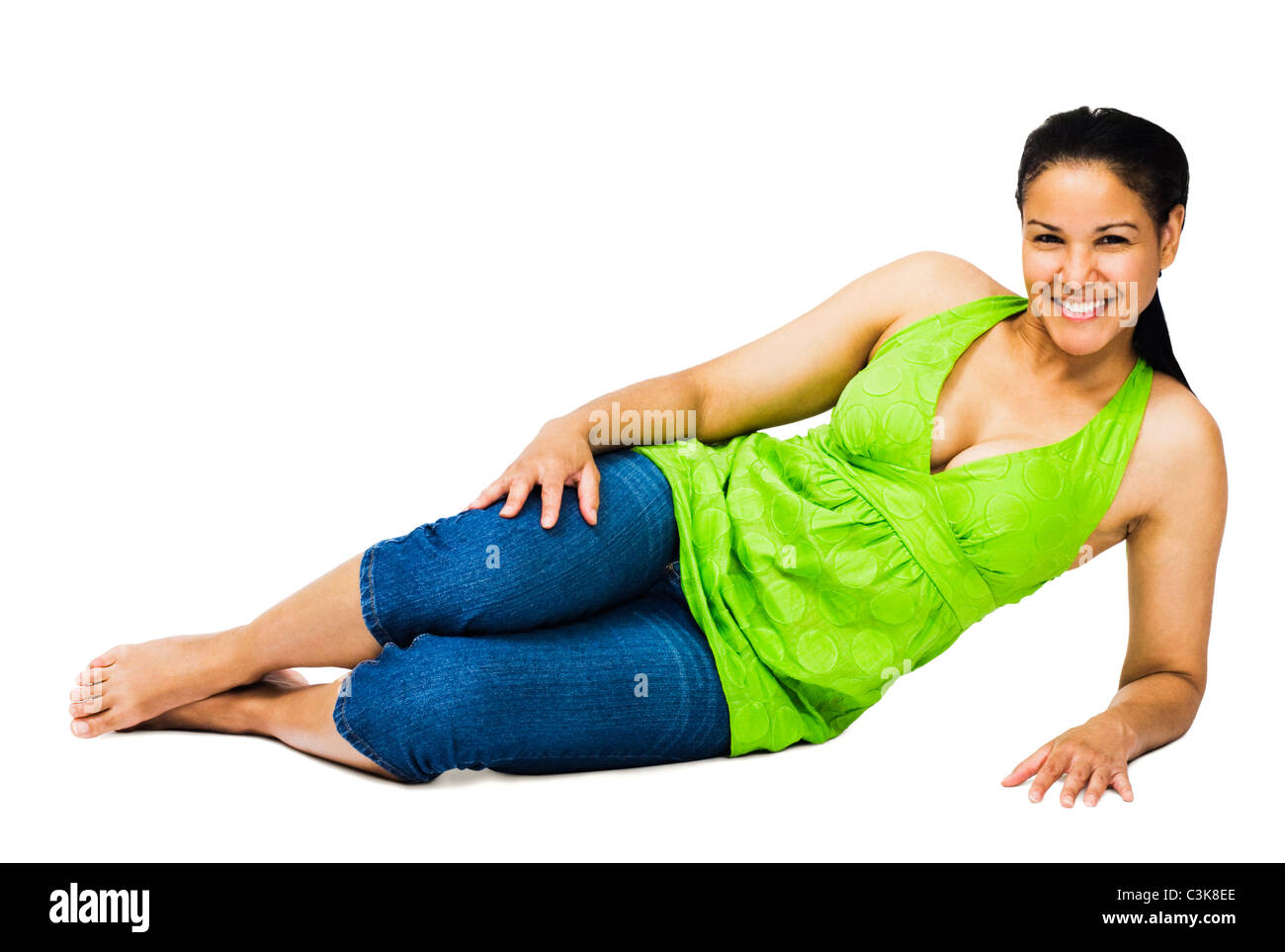 Confident woman reclining and smiling isolated over white Stock Photo ...