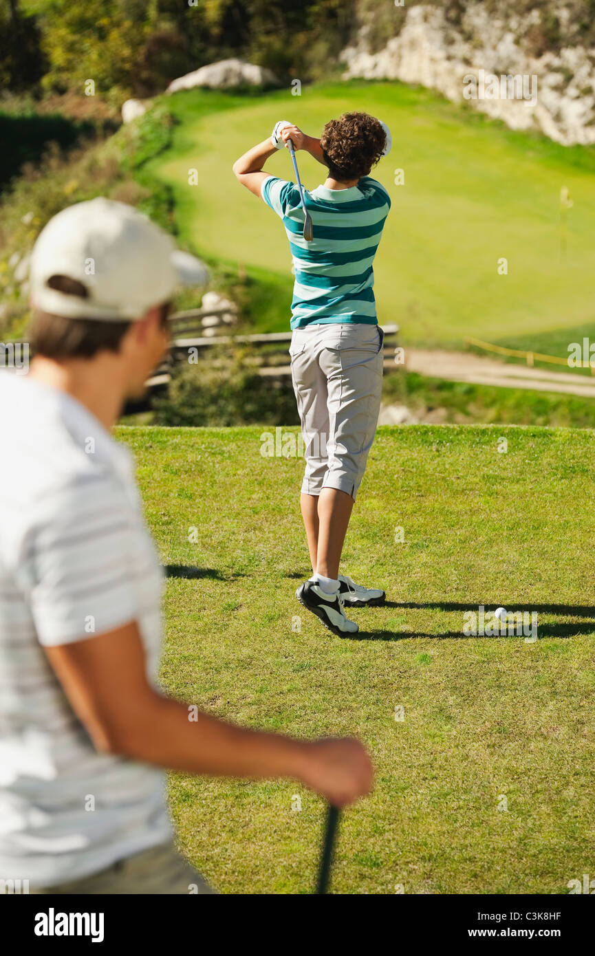 Two golfers taking a swing hi-res stock photography and images - Alamy