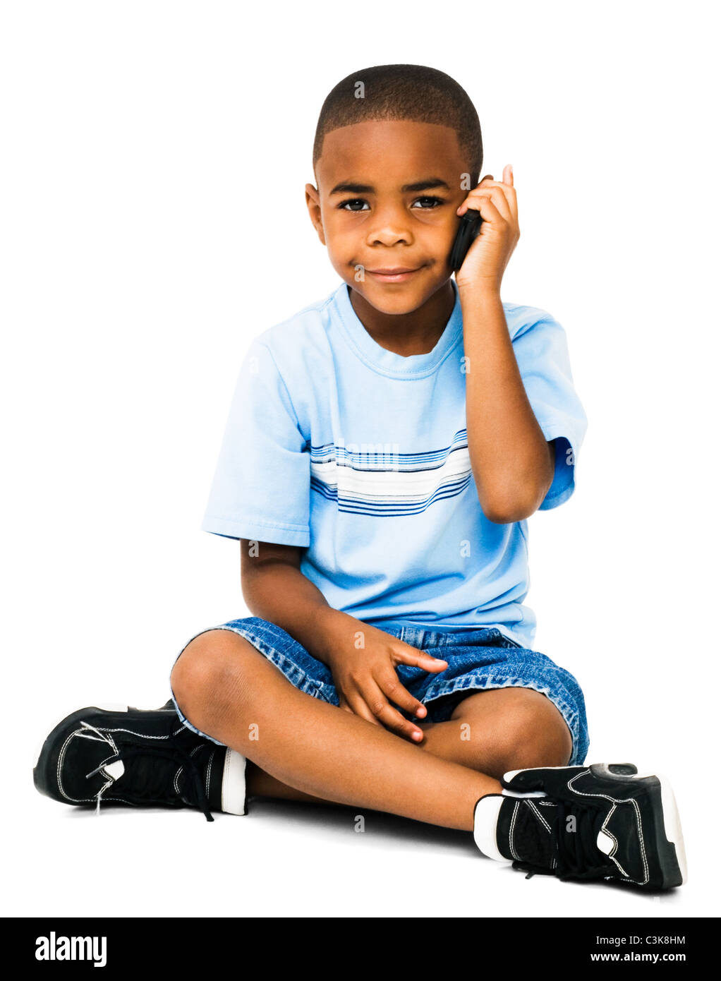 Smiling boy talking on a mobile phone isolated over white Stock Photo ...