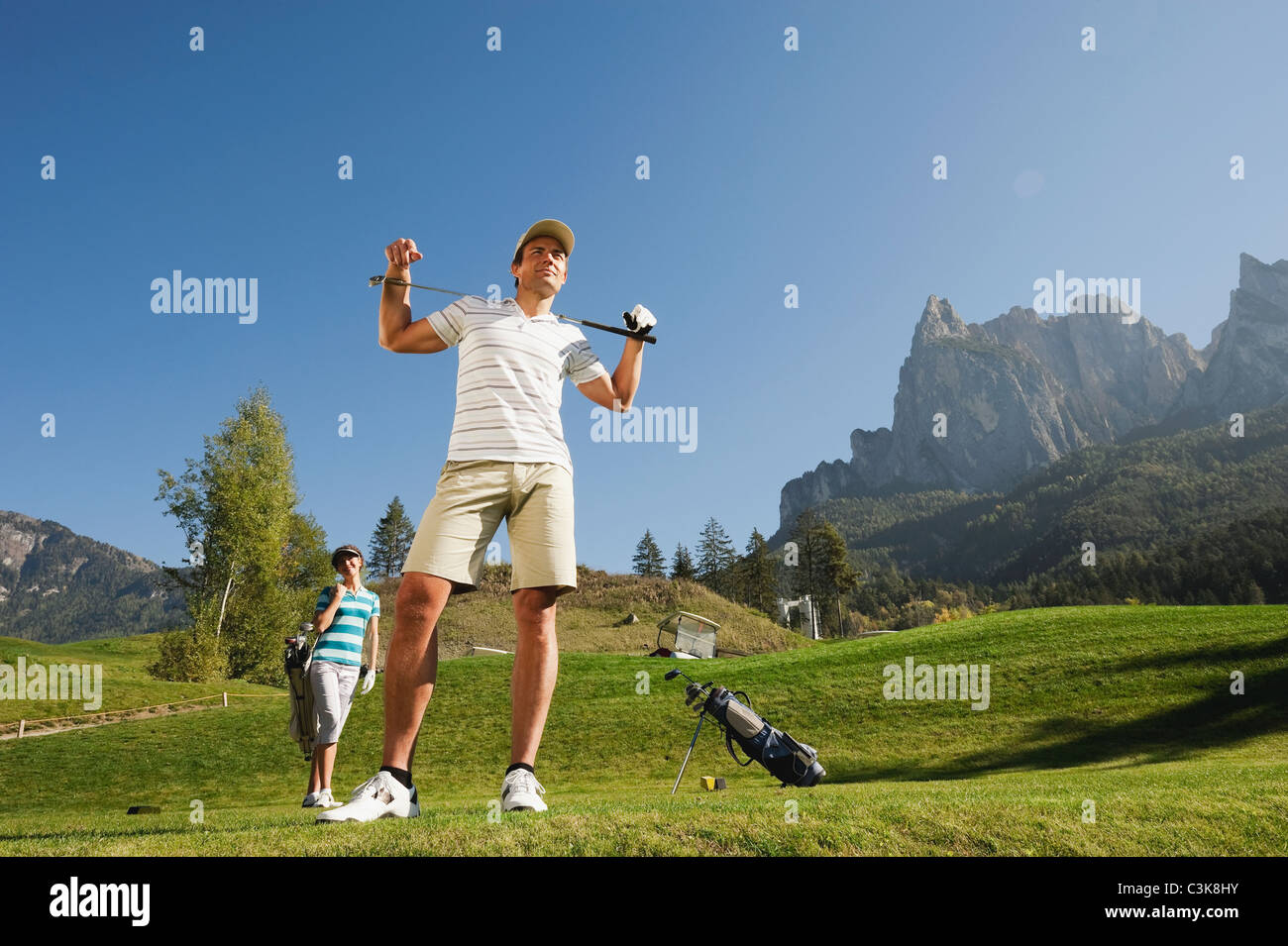 Italy, Kastelruth, Golfers on golf course Stock Photo - Alamy