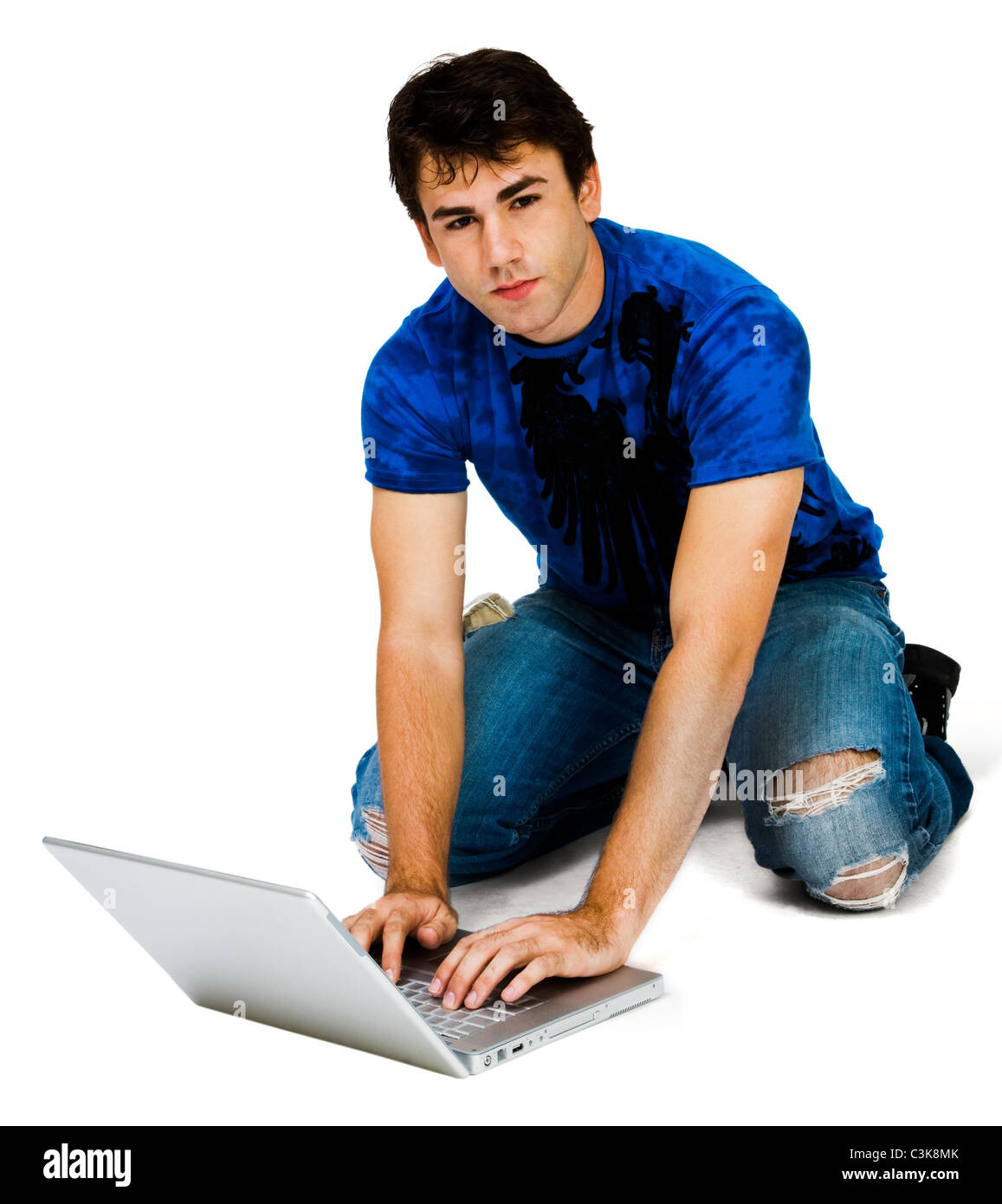 Handsome young man kneeling hi-res stock photography and images - Alamy