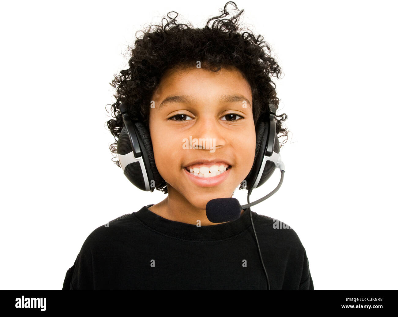 Boy wearing a headset and smiling isolated over white Stock Photo - Alamy