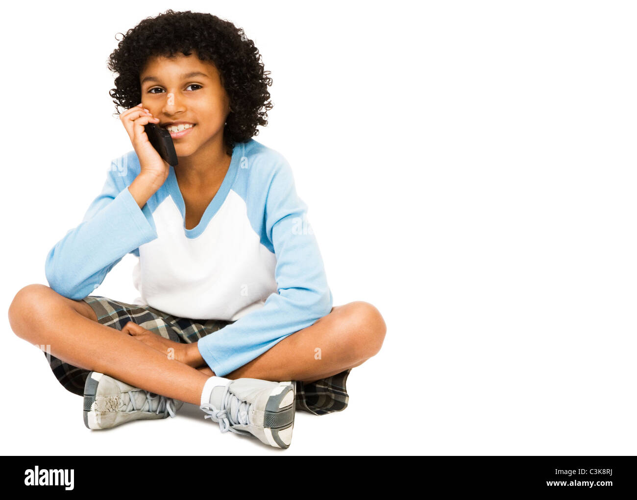 Boy talking on the phone isolated over white Stock Photo - Alamy