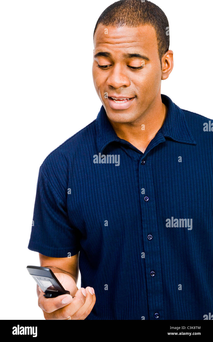 Mid adult man text messaging on a mobile phone isolated over white ...