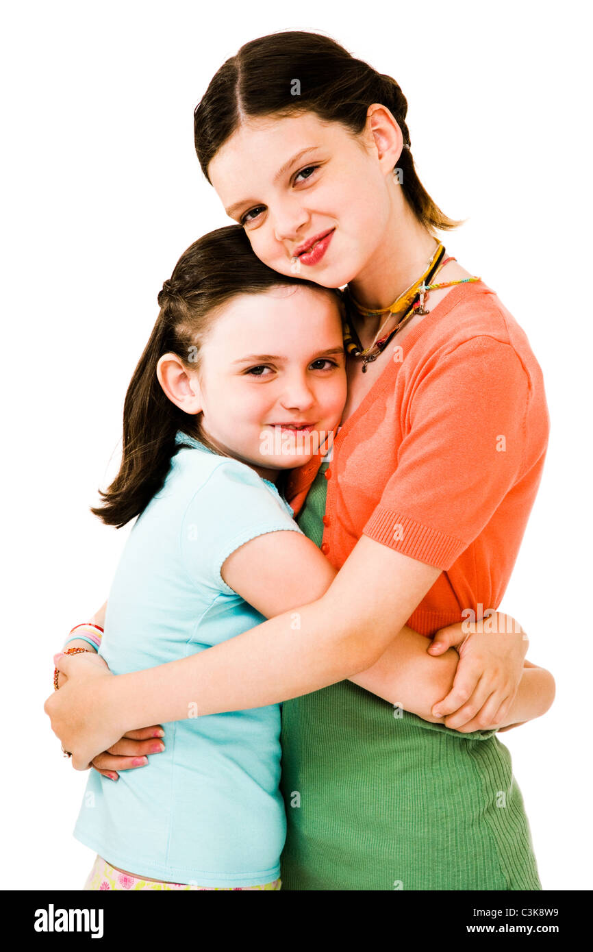 Happy girls hugging and posing isolated over white Stock Photo - Alamy