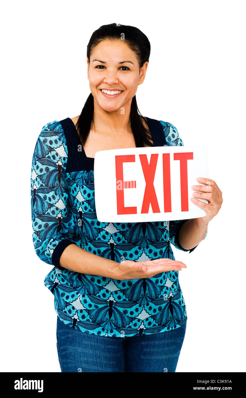 Beautiful woman holding exit sign and smiling isolated over white Stock ...