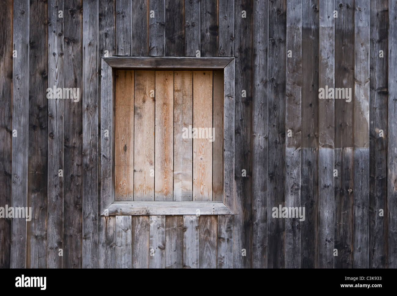 Austria, Closed window of wooden house Stock Photo - Alamy