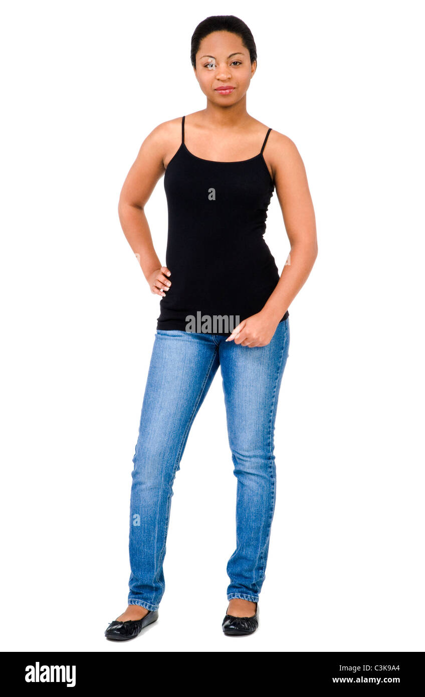 Young woman standing with her hand on her hip isolated over white Stock ...