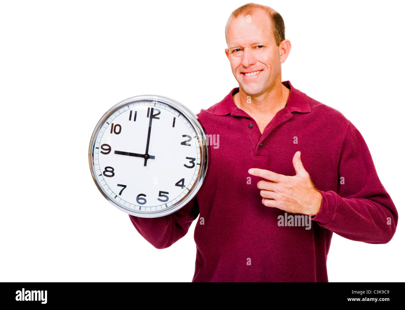 Caucasian man showing a clock and smiling isolated over white Stock ...