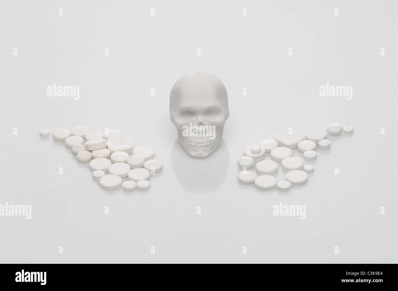 Skull, pills and drugs forming wings shape on white background Stock ...
