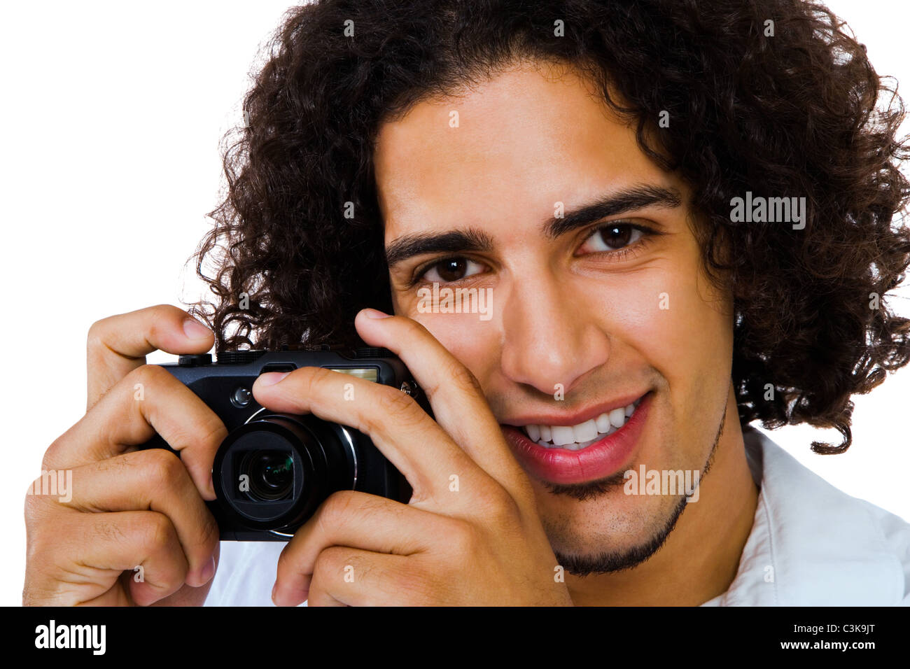 Portrait of a man photographing with a camera and smiling isolated over ...