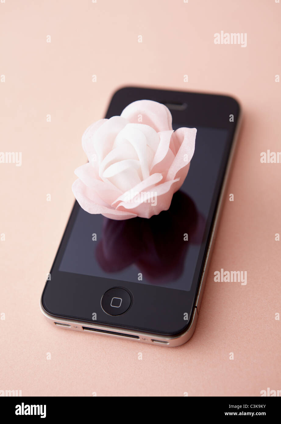Smartphone and flower Stock Photo - Alamy