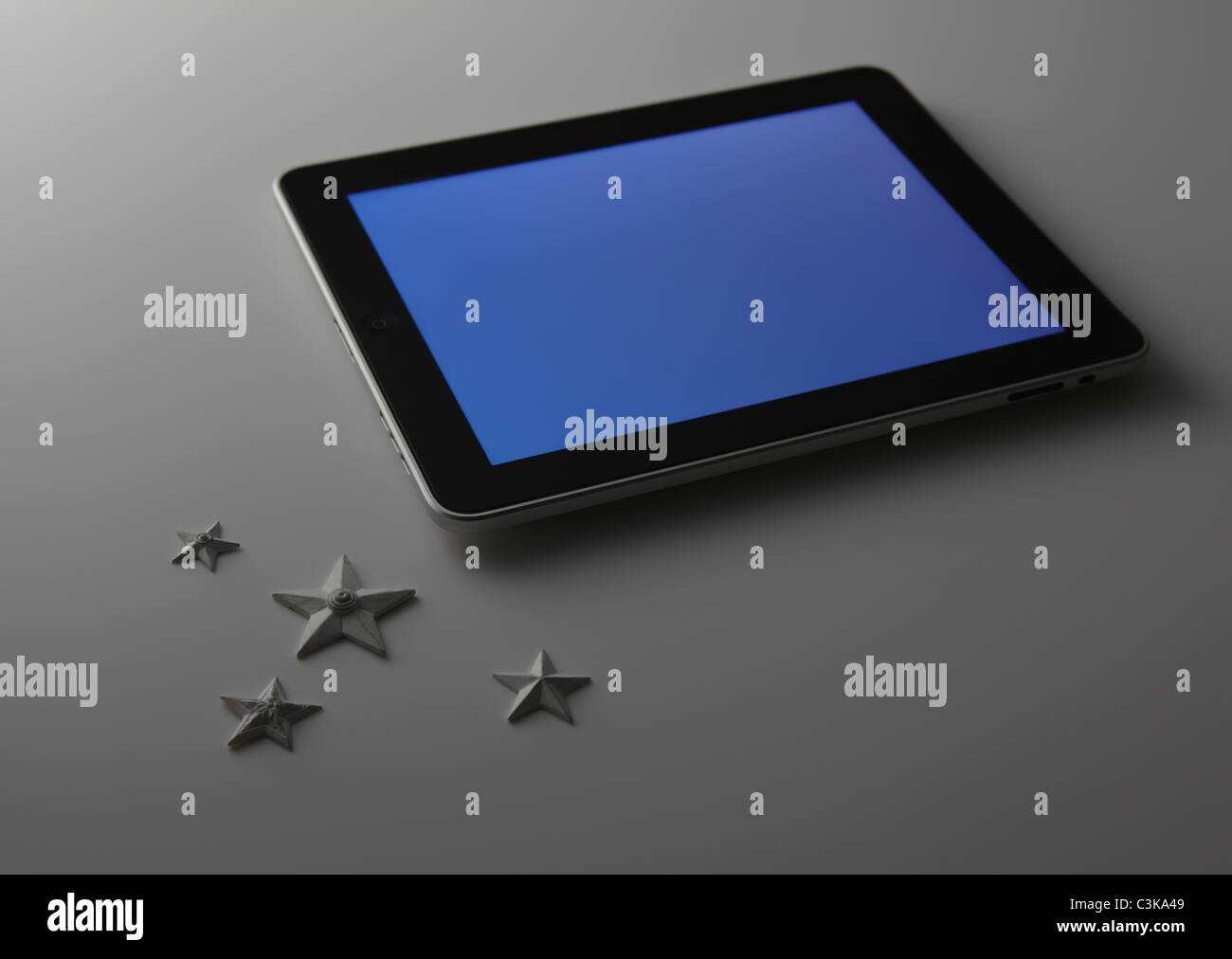 Tablet PC and star shaped ornaments Stock Photo - Alamy