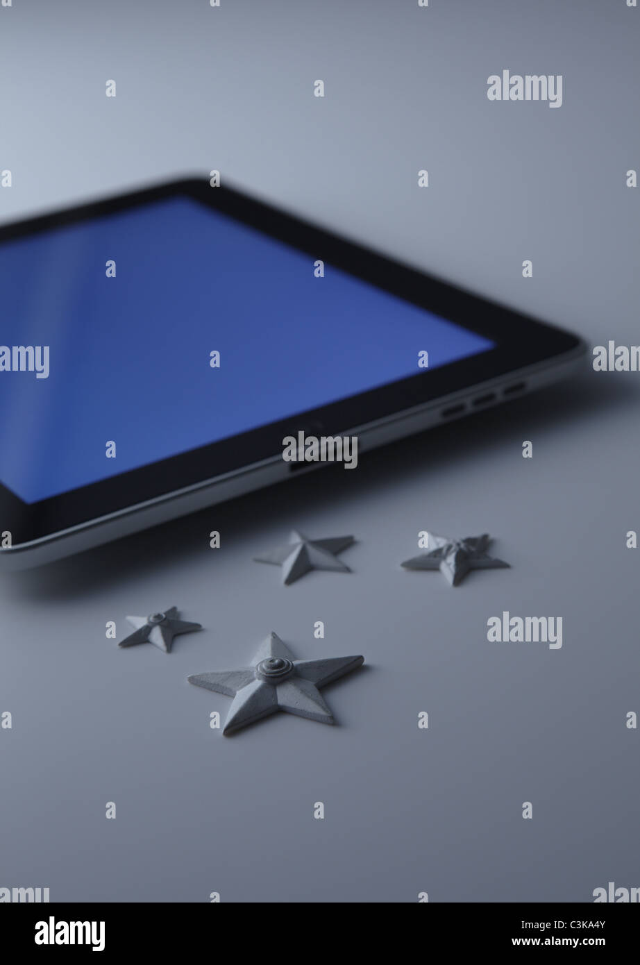Tablet PC and star shaped ornaments Stock Photo - Alamy