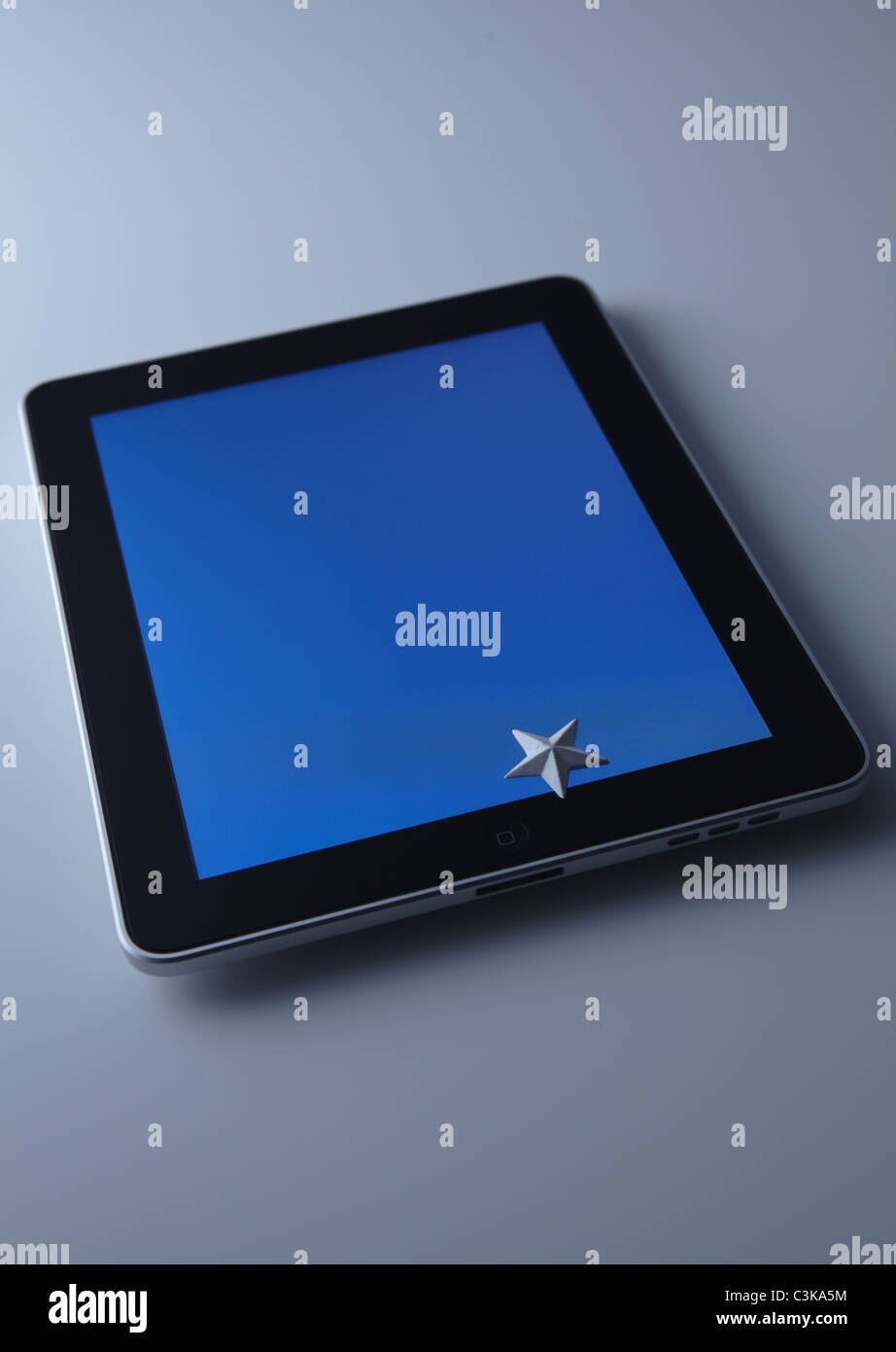 Tablet PC and star shaped ornament Stock Photo - Alamy