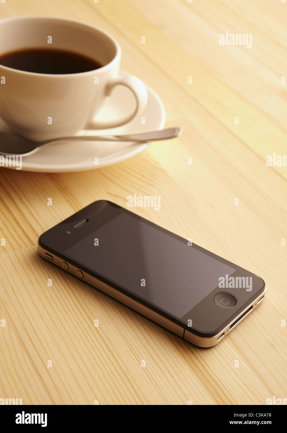 Smartphone and hot coffee Stock Photo - Alamy