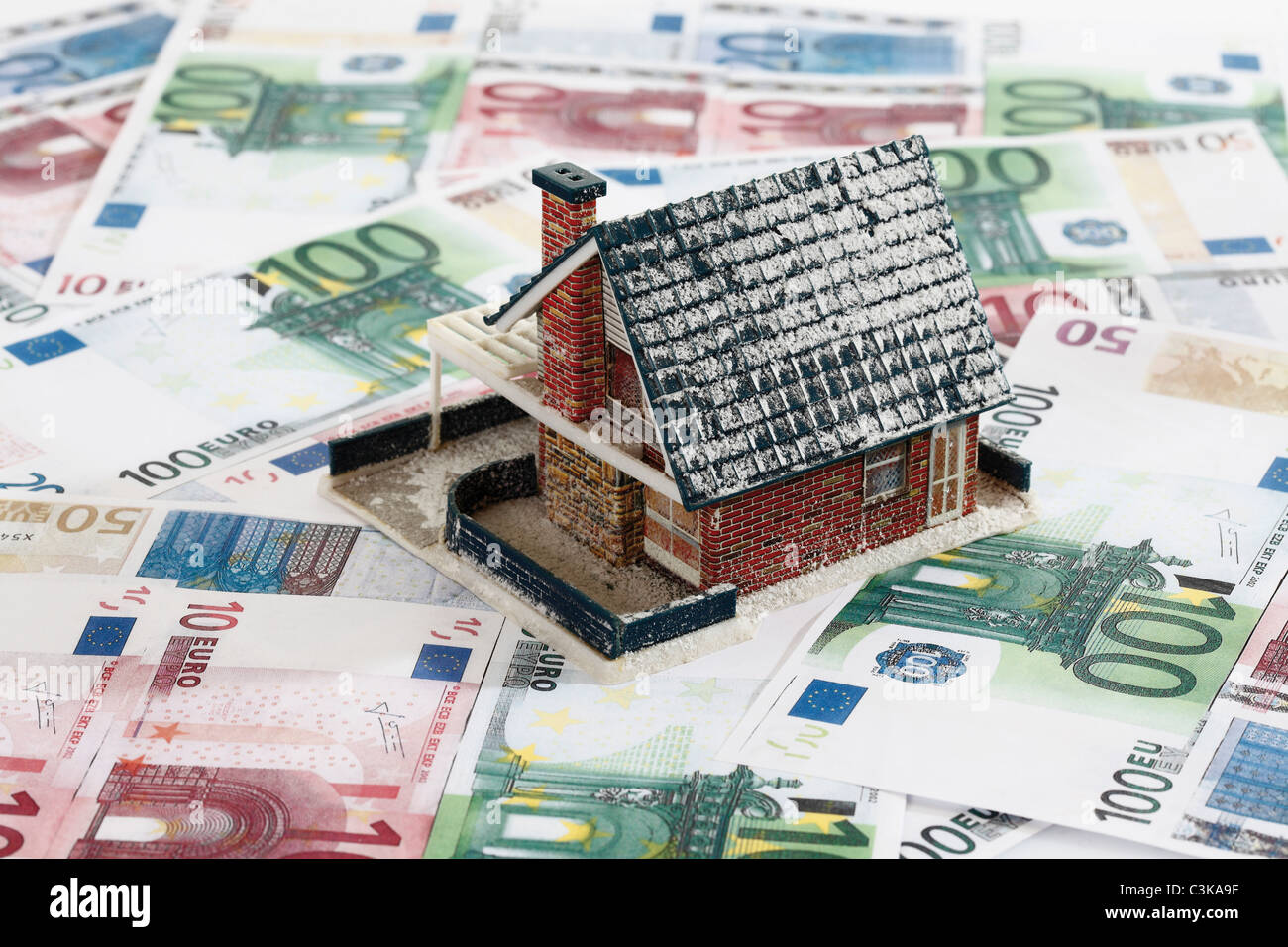 Model household on euro bank notes Stock Photo - Alamy