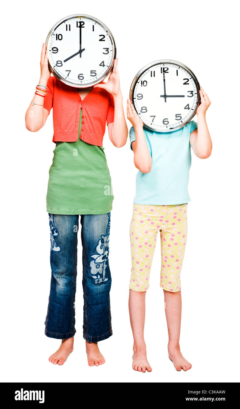Caucasian girls holding clocks isolated over white Stock Photo - Alamy
