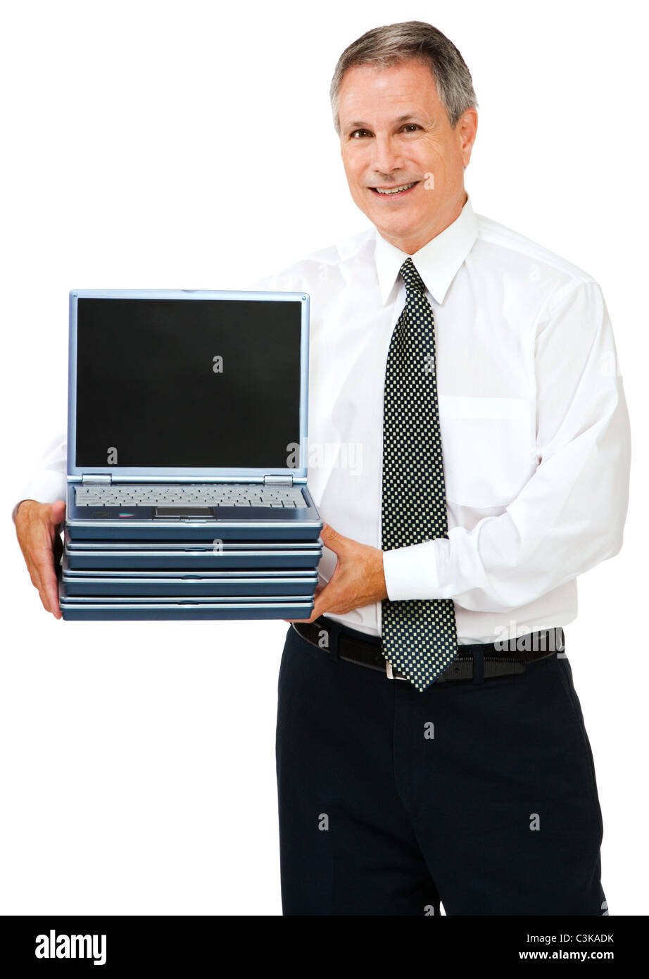Businessman holding a stack of laptops isolated over white Stock Photo ...