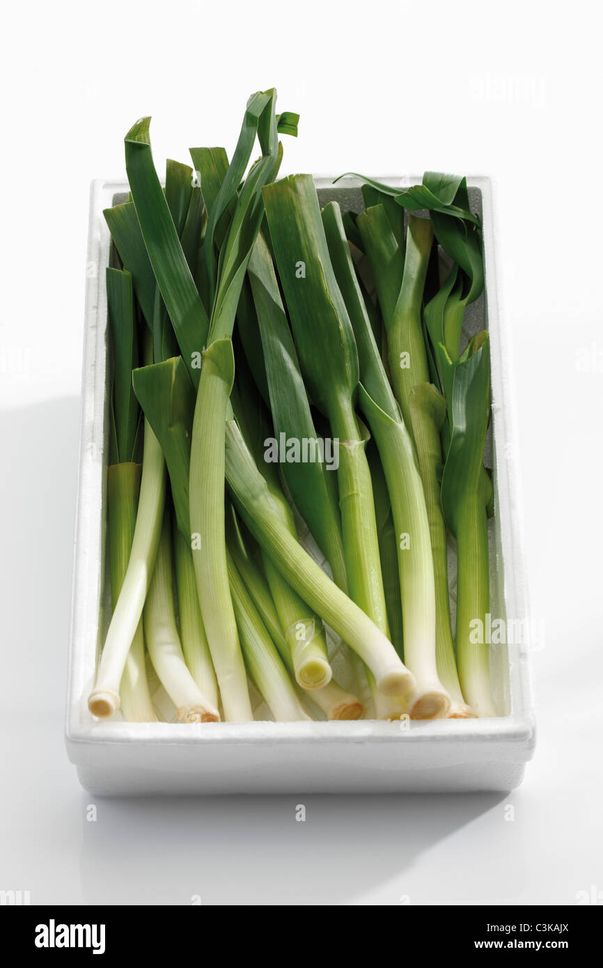 Baby leek in tray Stock Photo - Alamy