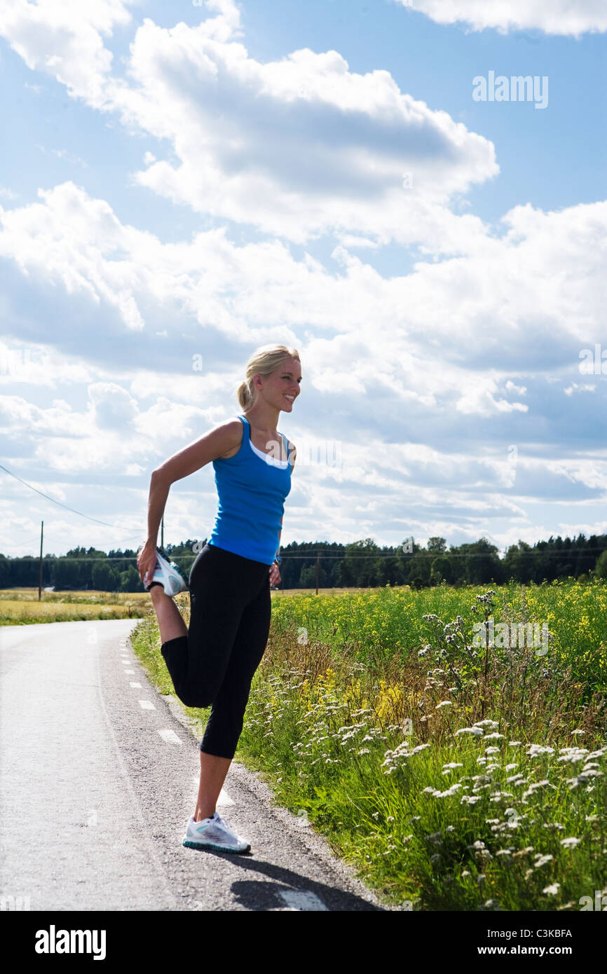 A woman doing stretching exercises, Sweden Stock Photo - Alamy