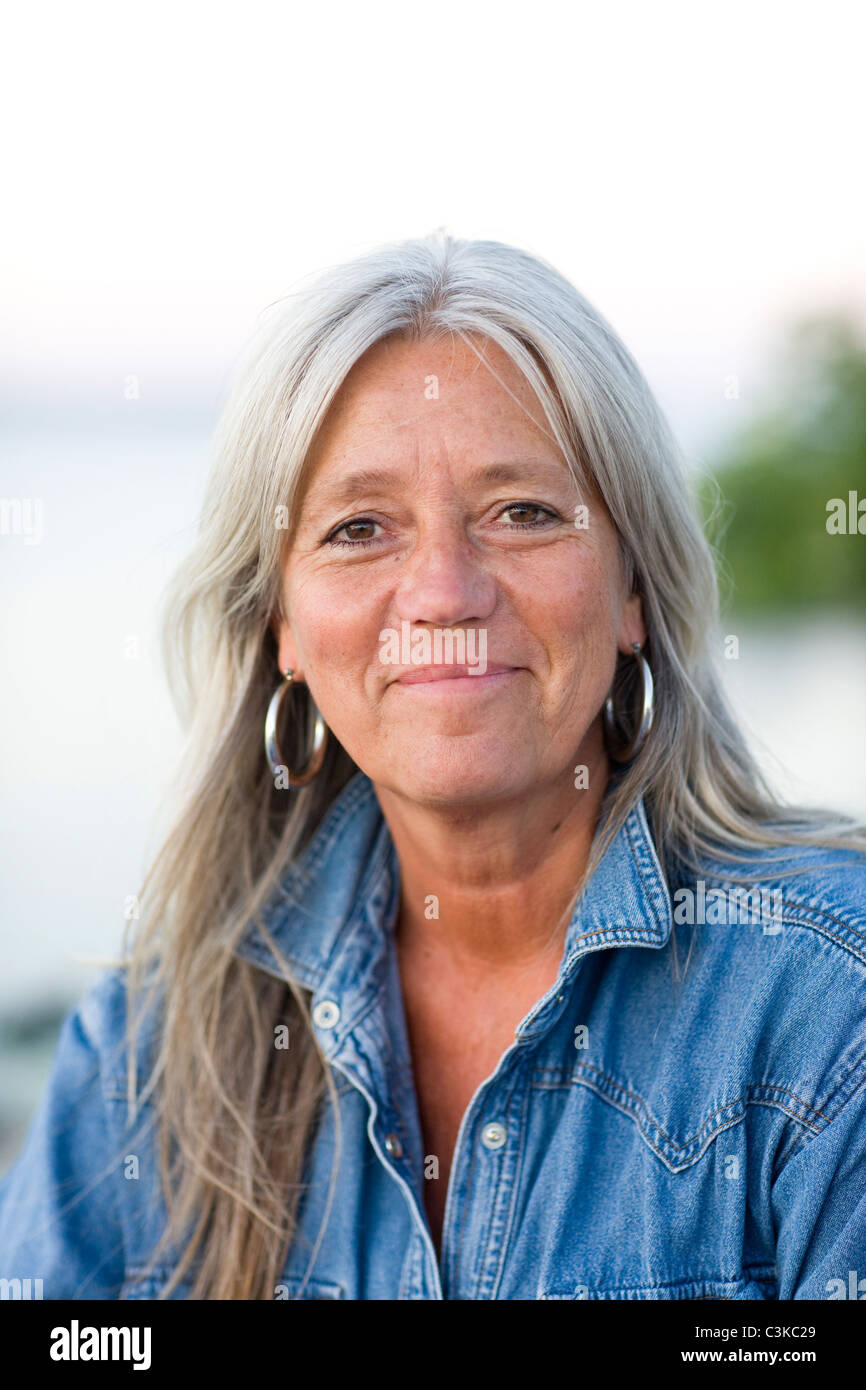 Happy mature woman looking jewel hi-res stock photography and images ...