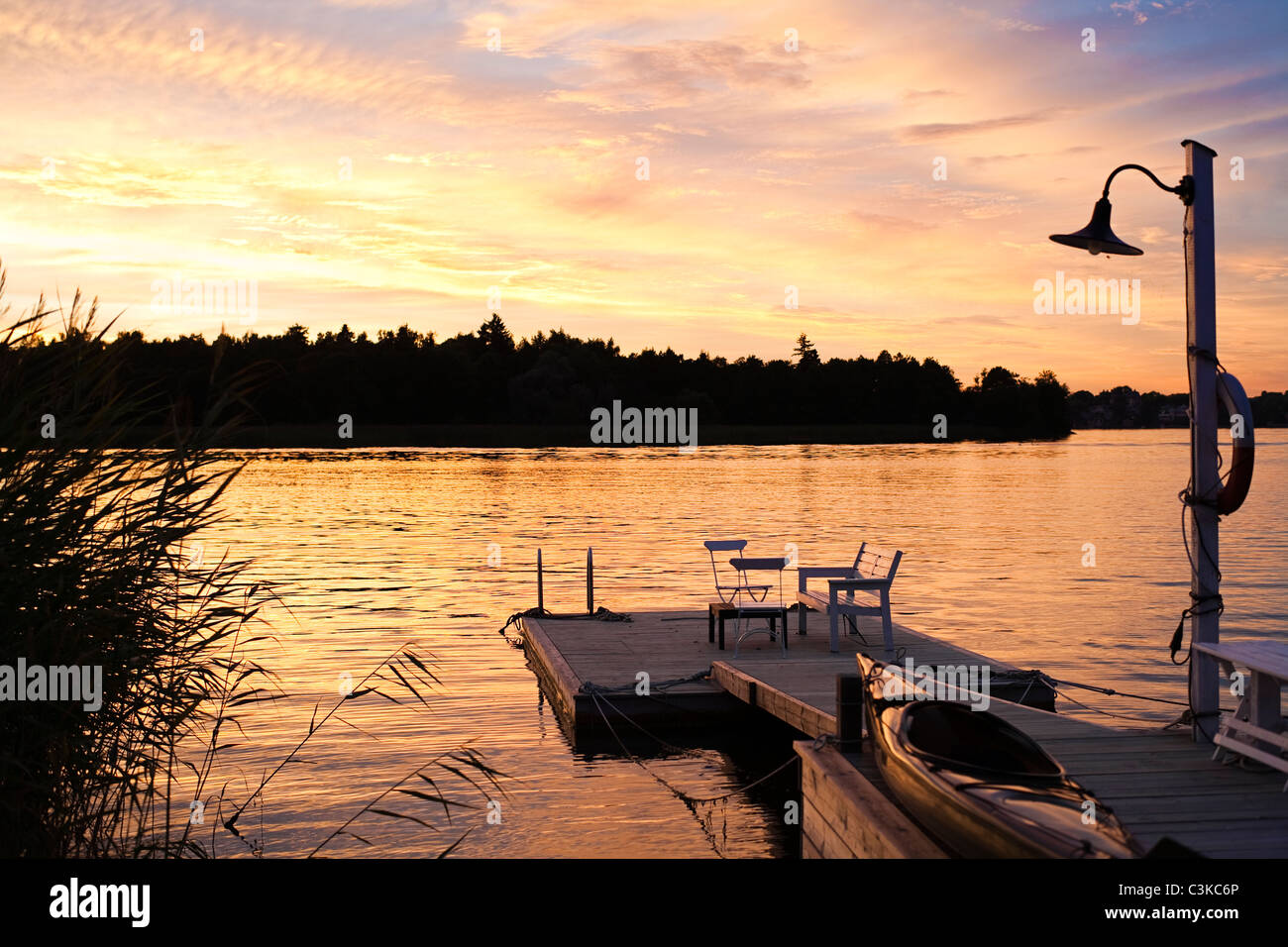 Dusk over water Stock Photo - Alamy