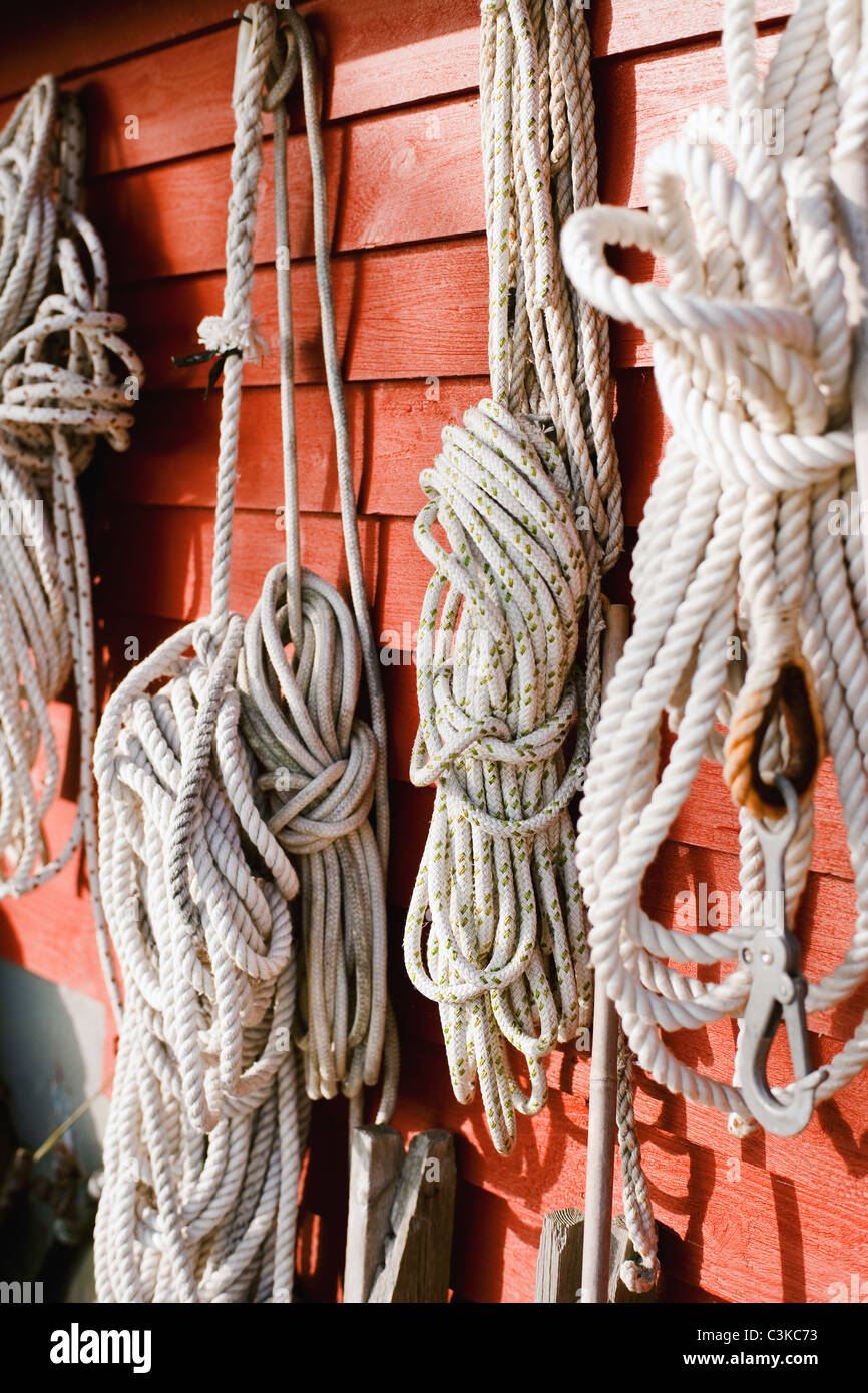Ropes hanging on wall Stock Photo - Alamy