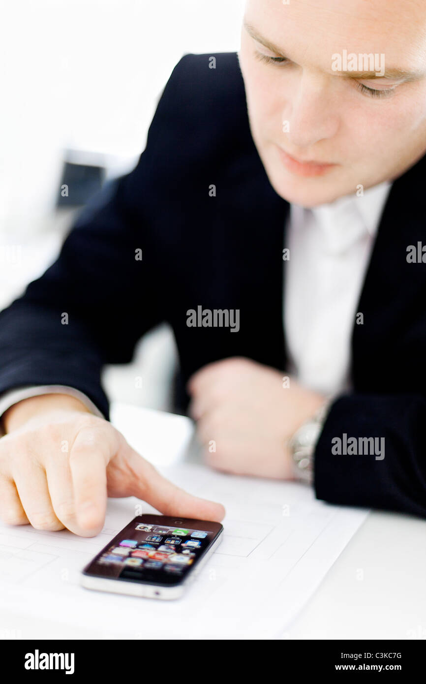 Man looking at mobile phone Stock Photo - Alamy