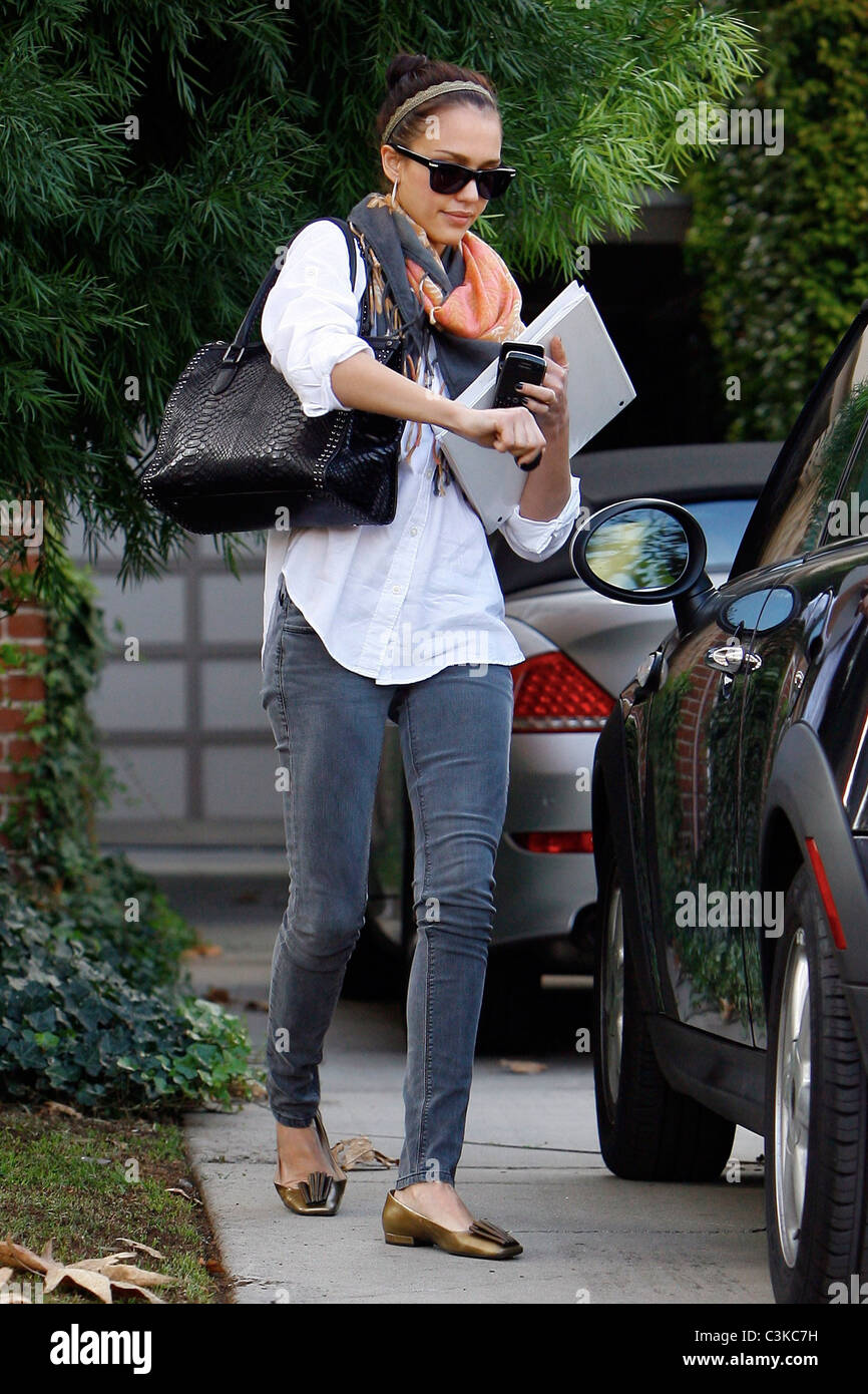 Jessica Alba returns to her Mini Cooper after attending a business ...