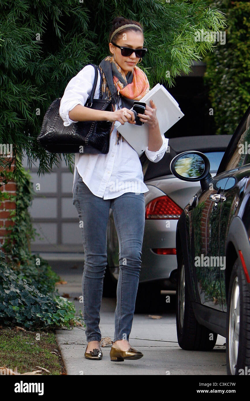 Jessica Alba returns to her Mini Cooper after attending a business ...