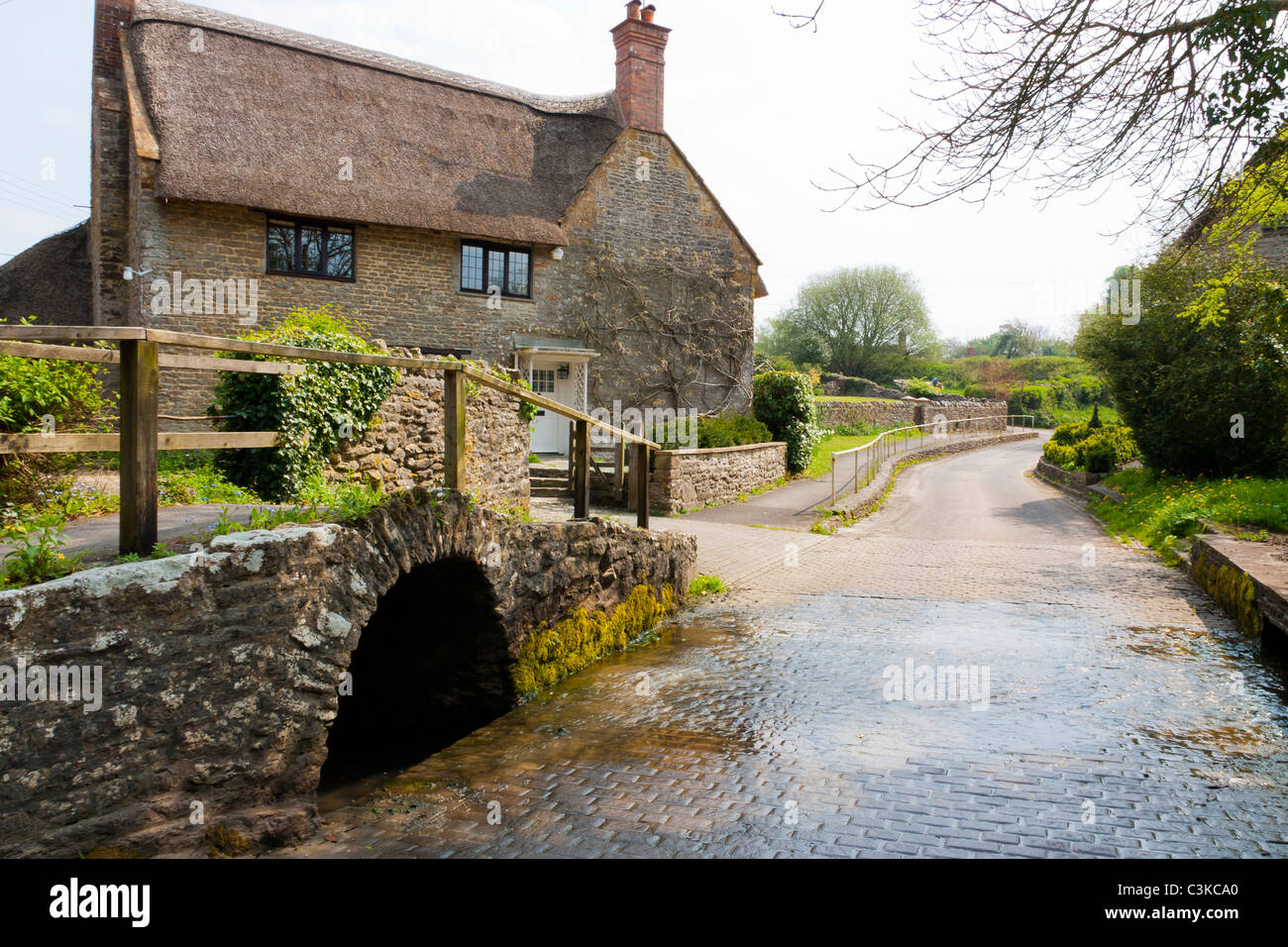 Bridge and river ford in the Dorset village of Melbury Osmond with a ...