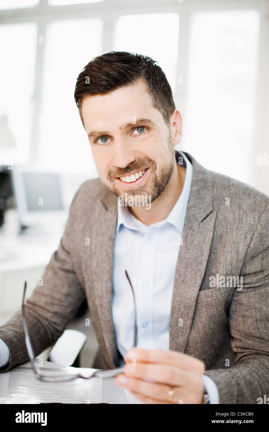 Man working in office Stock Photo - Alamy