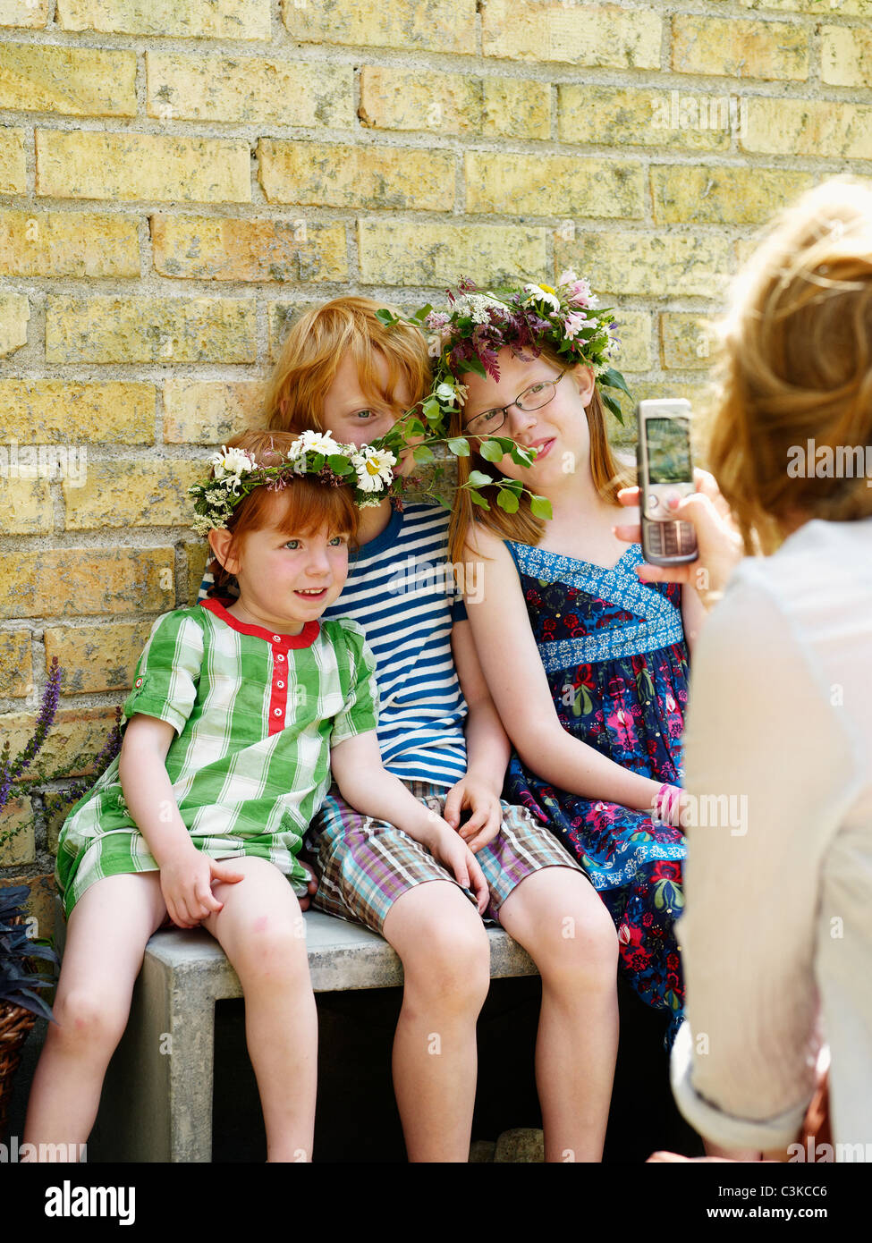 Four girls sitting on the bench hi-res stock photography and images - Alamy
