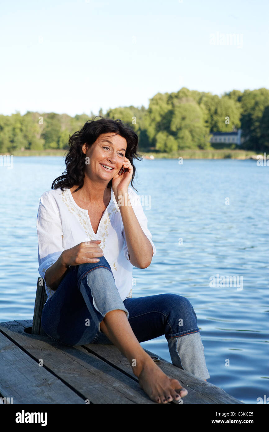 A woman using a mobile phone, Sweden Stock Photo - Alamy
