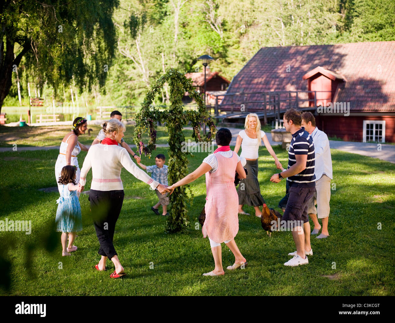 Men, women and children dancing in circles Stock Photo - Alamy