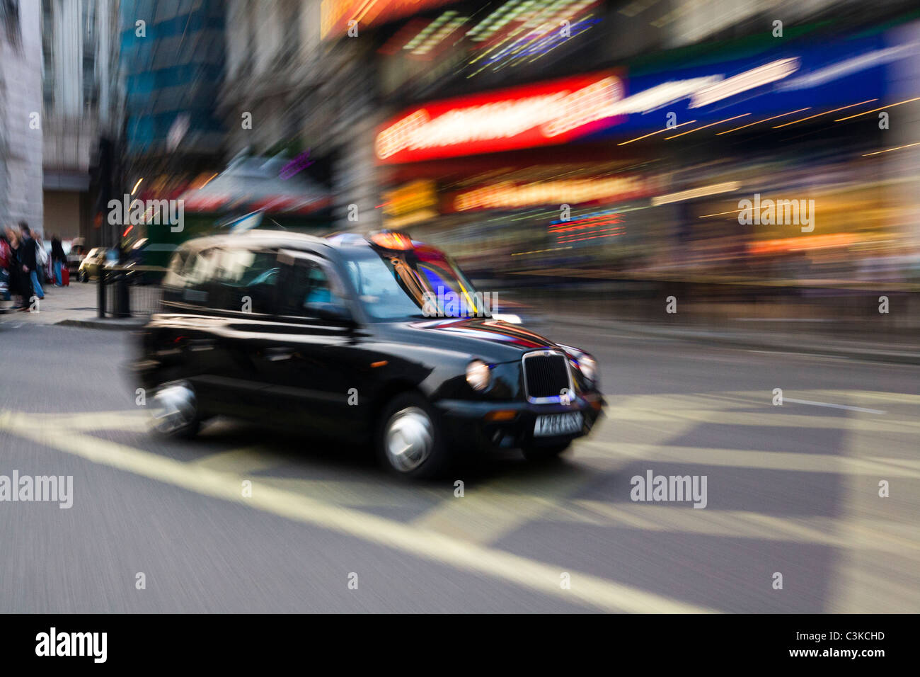 Car passing by city shops Stock Photo - Alamy