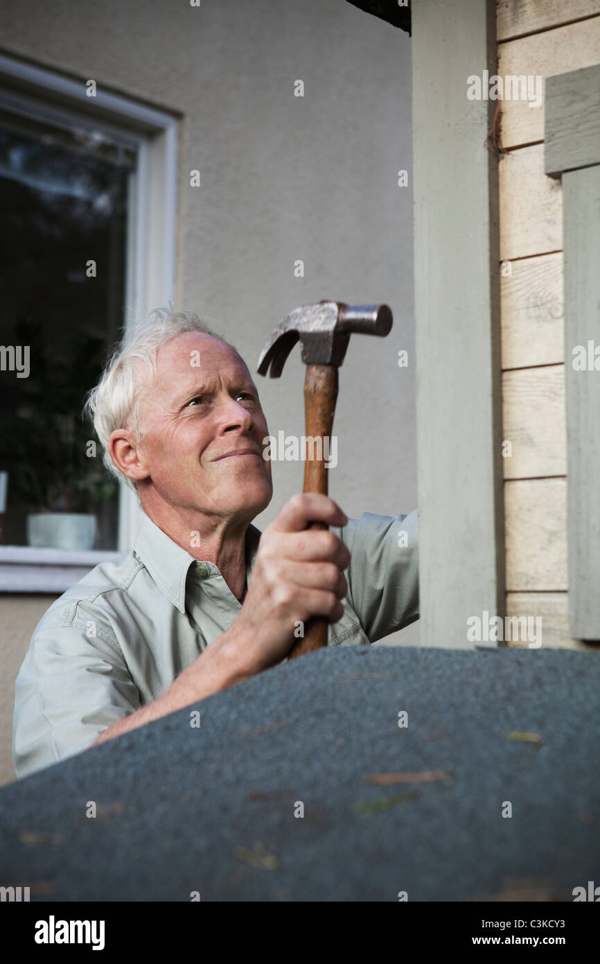 Man holding hammer shoulder hi-res stock photography and images - Alamy