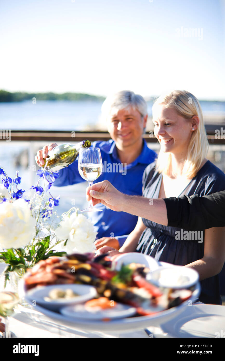 Three people celebrating in restaurant Stock Photo - Alamy