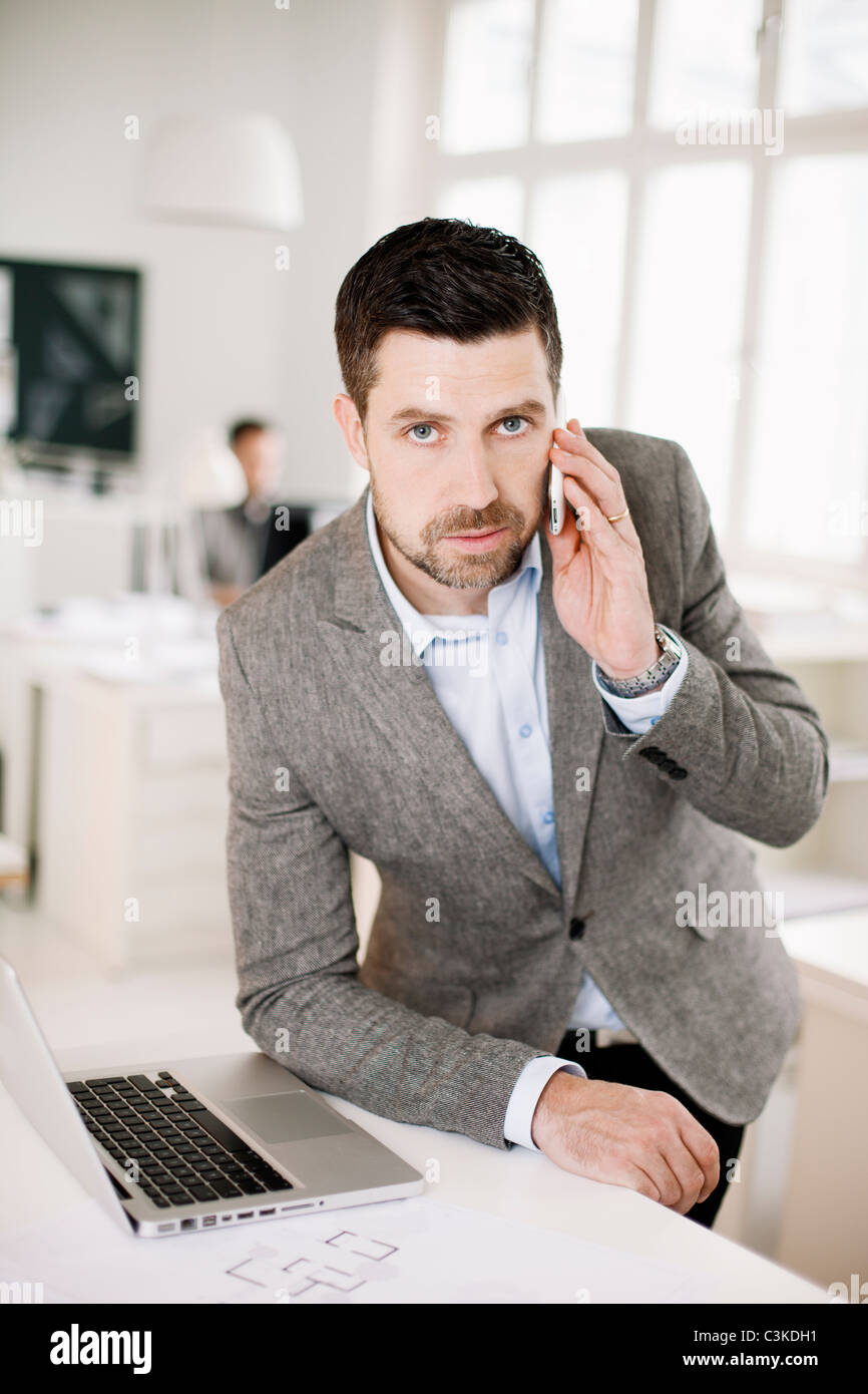 Man working in office Stock Photo - Alamy