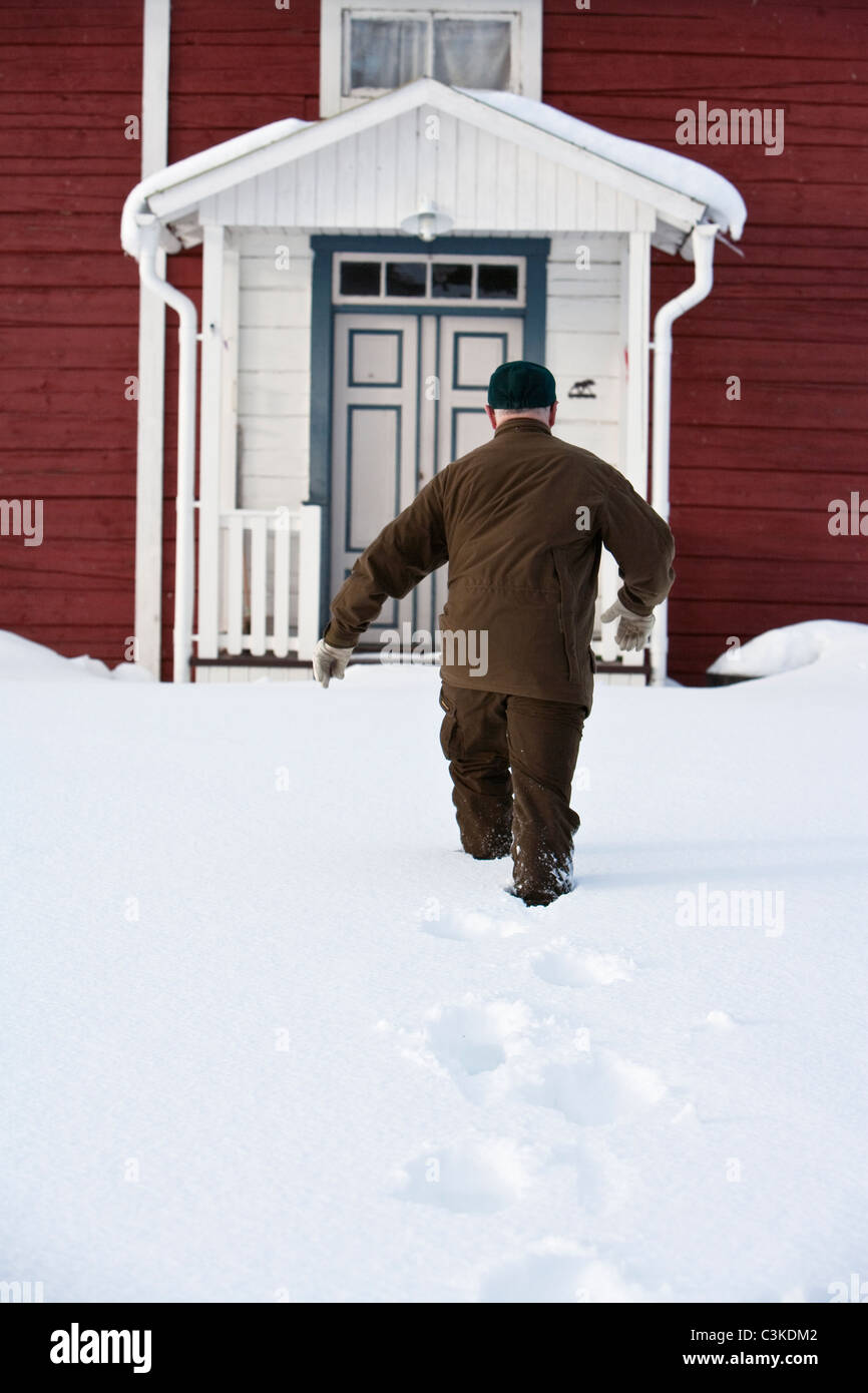 Man walking into a building hi-res stock photography and images - Alamy