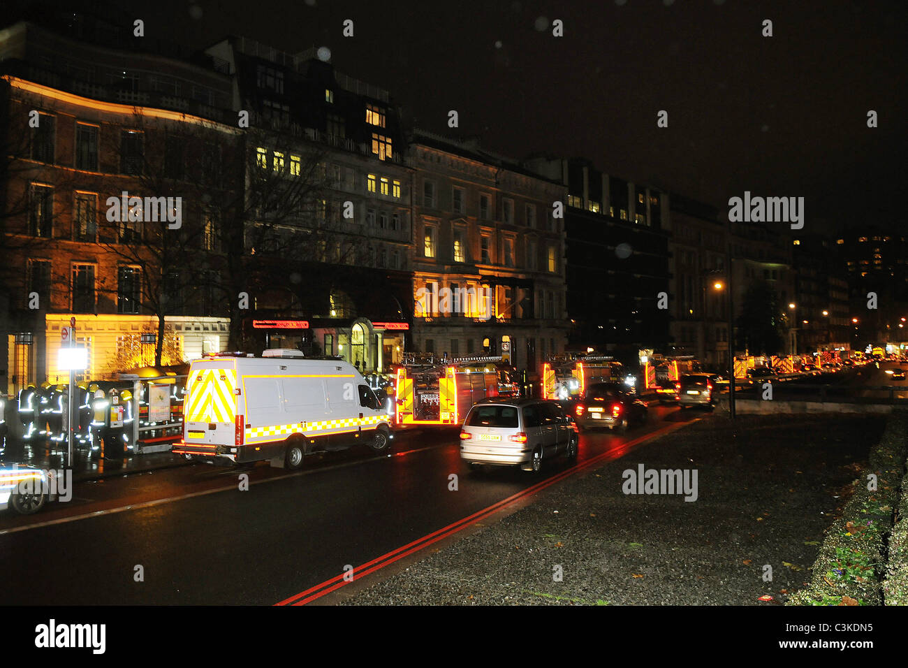 Fire crews and emergency services cordon off a building next to the ...